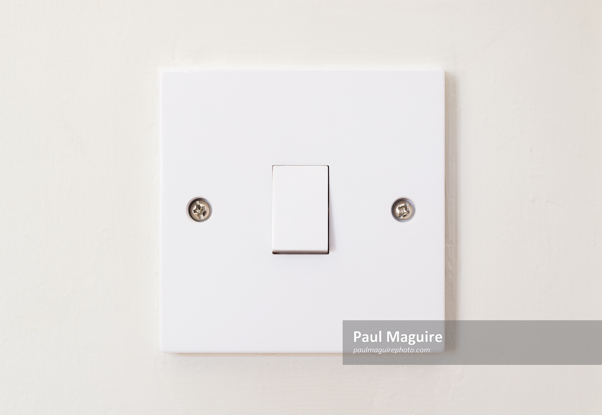 Stock photo - Light switch on a wall, UK - Paul Maguire
