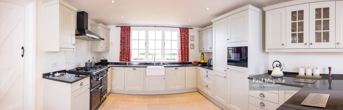 Stock photo - Modular painted wood kitchen panorama, panoramic, UK ...