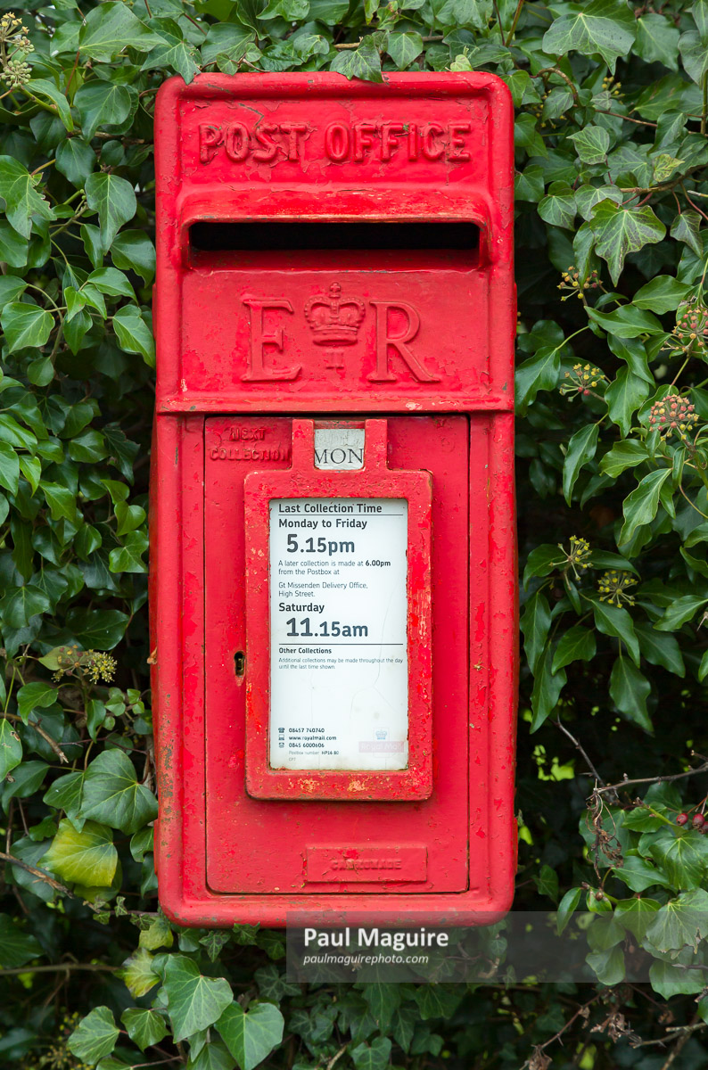 Buy a photo of Post box, red Royal Mail postbox on wall, UK - Paul Maguire