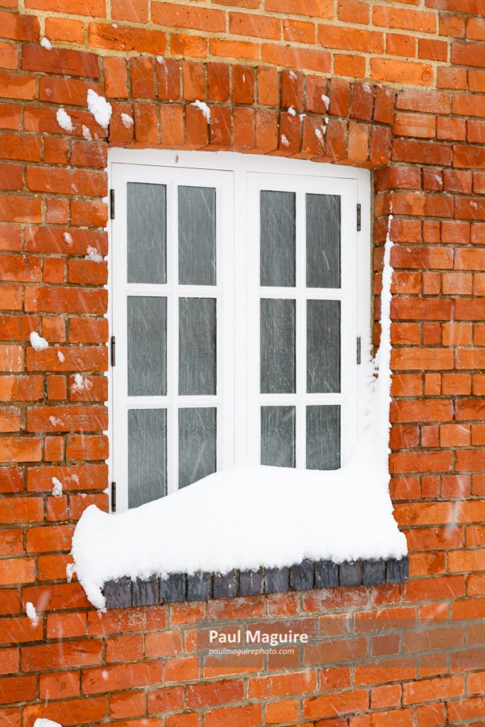 Stock photo - Snow covered house window - Paul Maguire