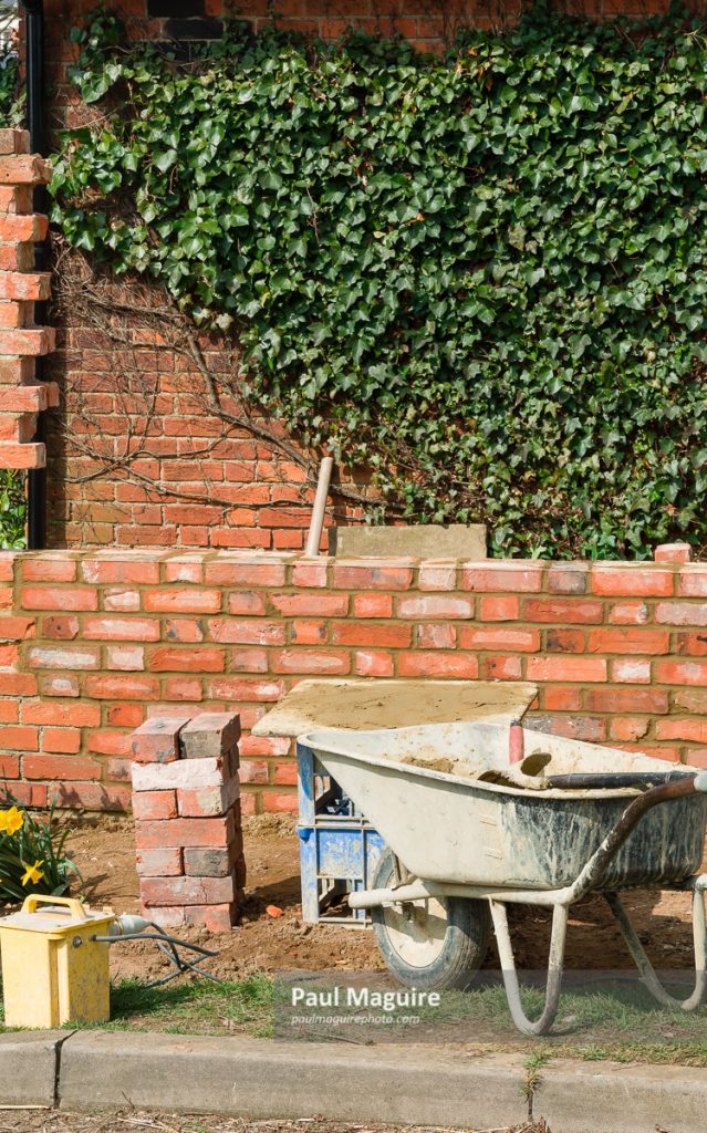 Stock photo - Brick laying, building a brick garden wall, UK - Paul Maguire